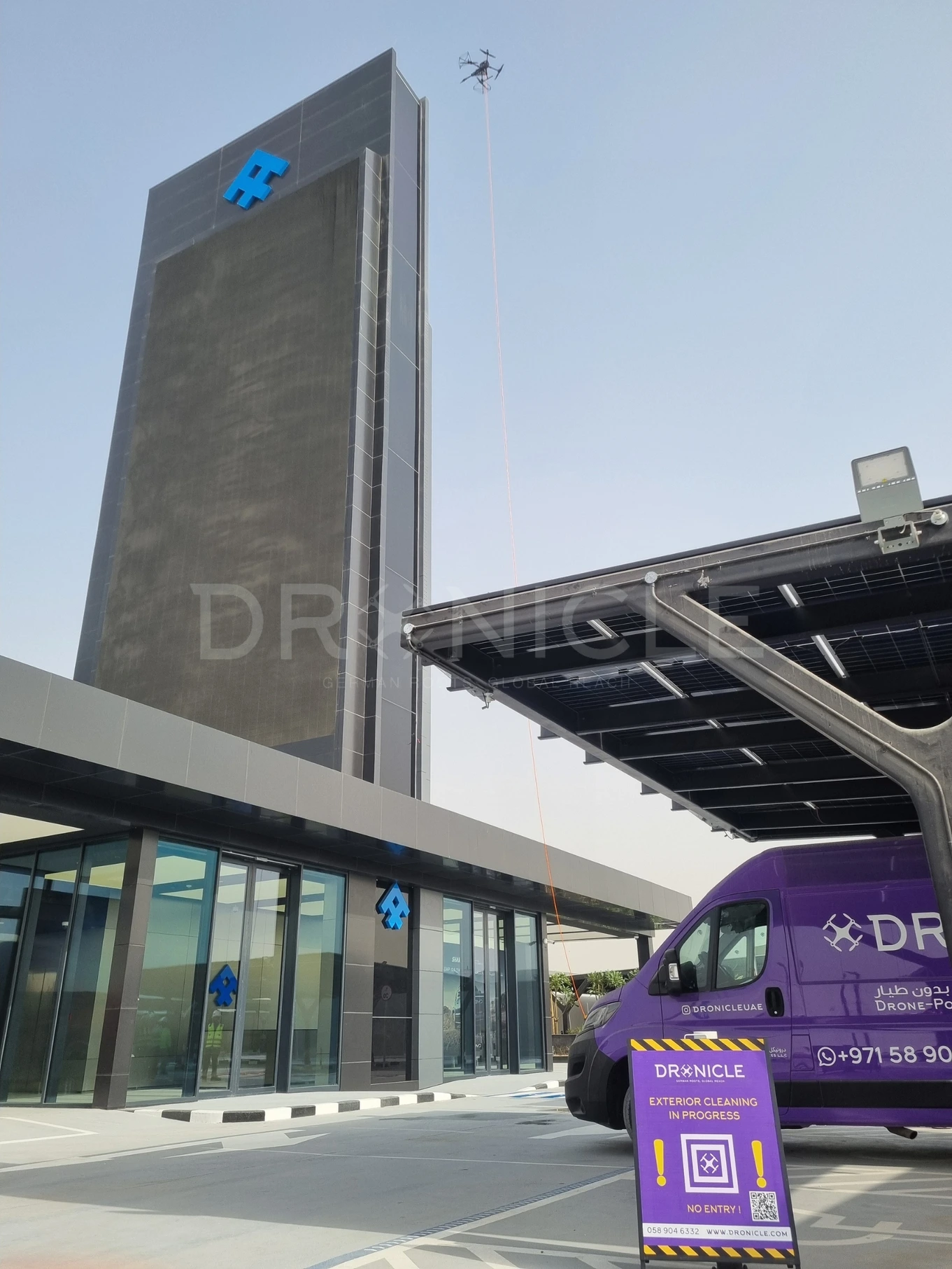 Professional drone billboard cleaning services - DRONICLE.